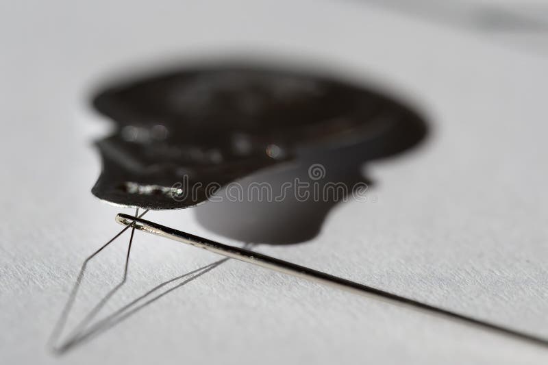 Sewing Needle Threader Tool in Use and a Single Black String. Stock ...