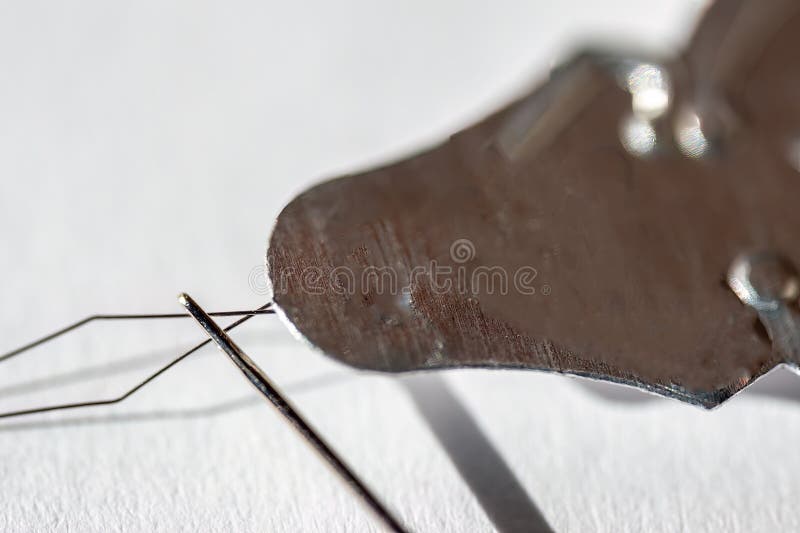Sewing Needle Threader Tool in Use and a Single Black String. Stock ...