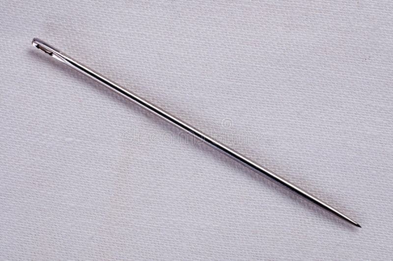 Sewing Needle on a White Cloth Stock Photo - Image of white, pattern ...
