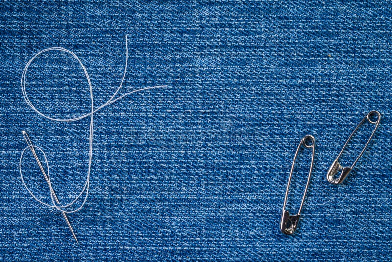 Sewing Needle And Thread On Denim With Copy Space Closeup Stock Image ...