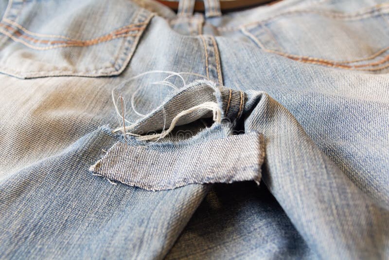 Sewing Needles and Thread, Embroidered on the Denim Pants Stock Image ...