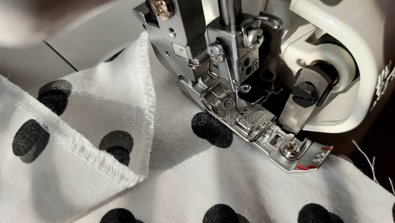 Sewing on an overlock stock image. Image of polka, textile - 363664509