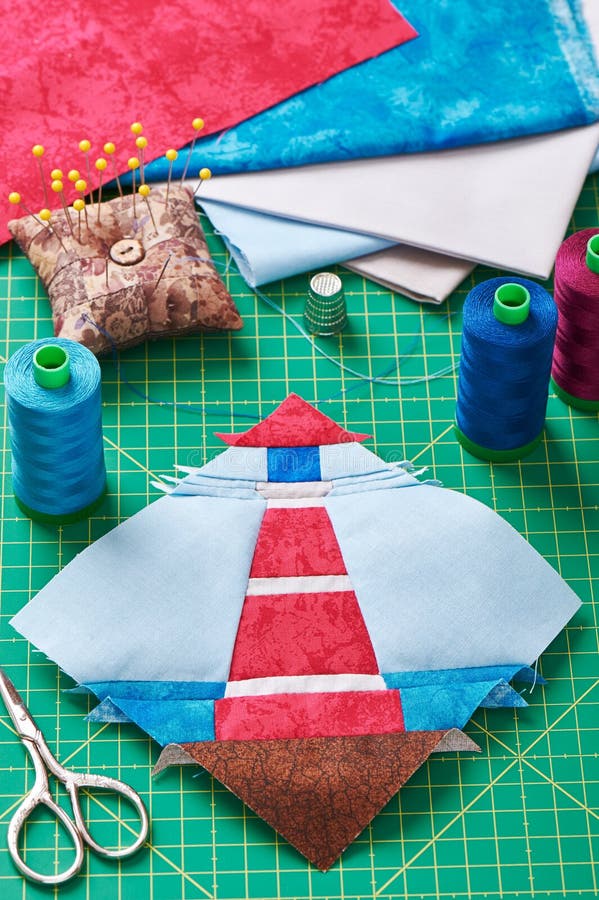 Sewing Patchwork of Block of Lighthouse Surrounded by Accessories Stock ...
