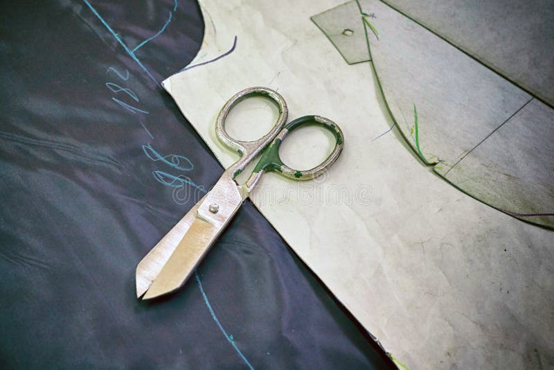 Sewing Pattern on Fabrics Ready To Cut Surrounded Stock Image - Image ...