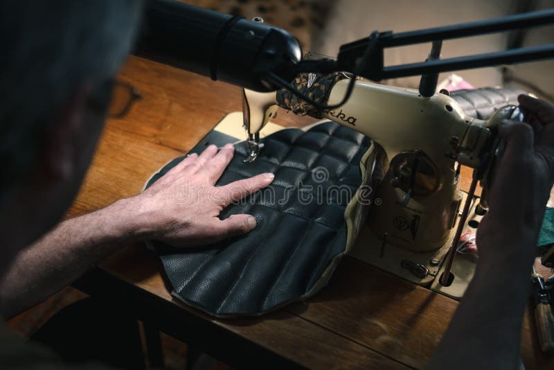Sewing Process of the Leather Belt. Old Man`s Hands Behind Sewing ...