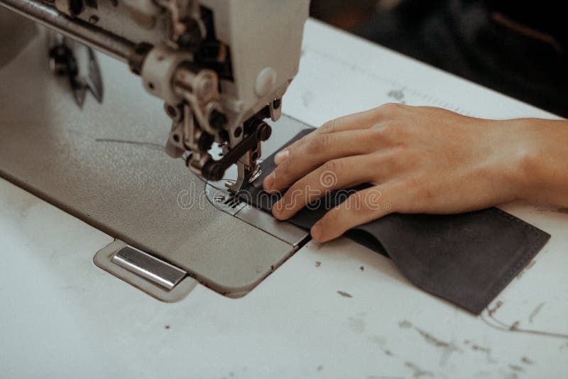 Sewing Process of the Leather Wallet. Man`s Hands Behind Sewing ...