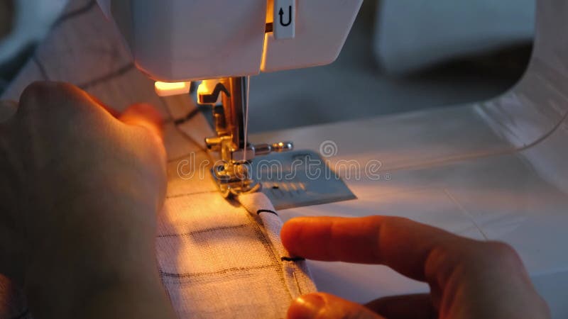 Sewing Process on a Sewing Machine, a Needle with a Thread and a Holder ...