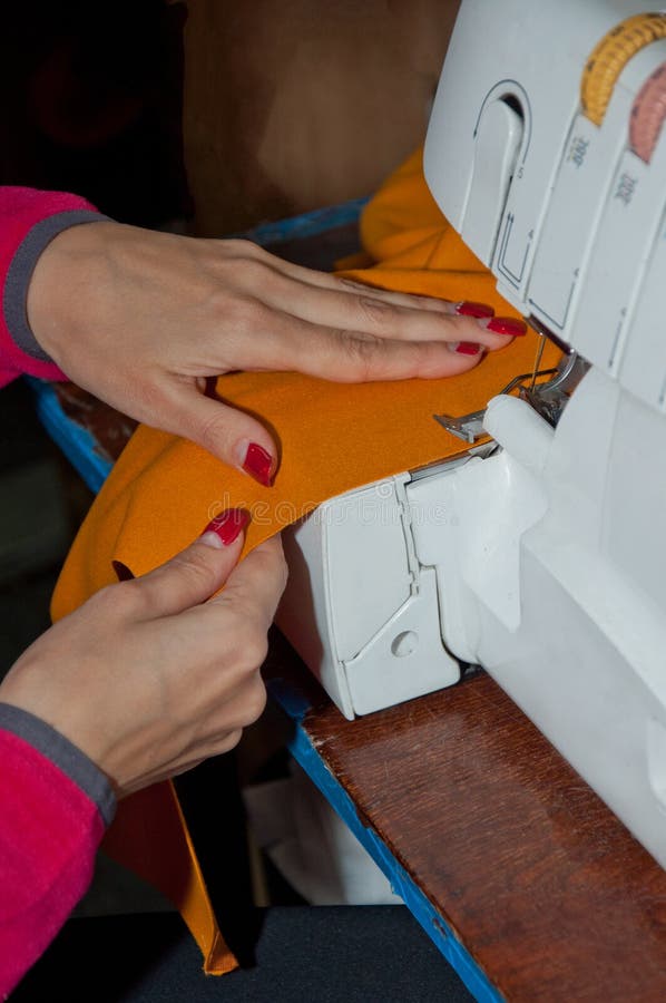 Sewing Process stock photo. Image of machine, orange - 59543854
