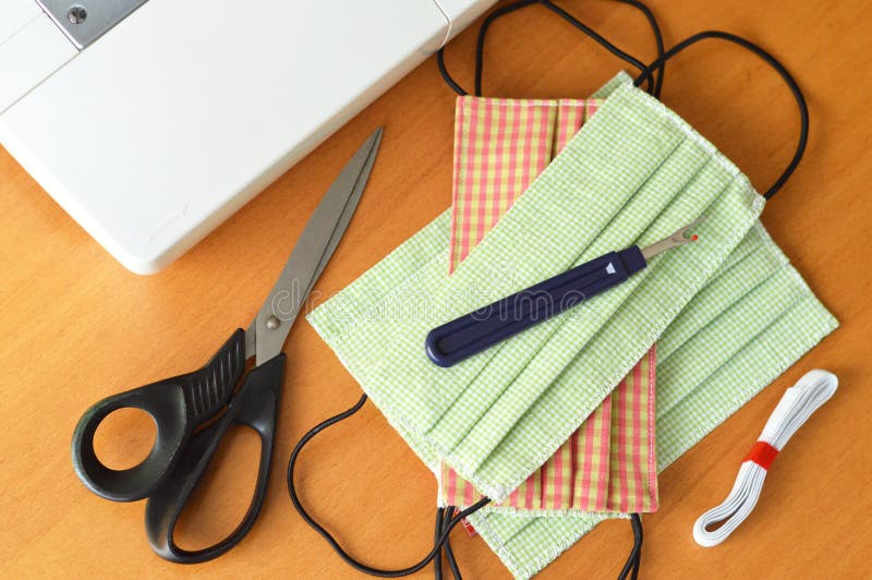 Sewing a protective mask stock photo. Image of medical - 179995156