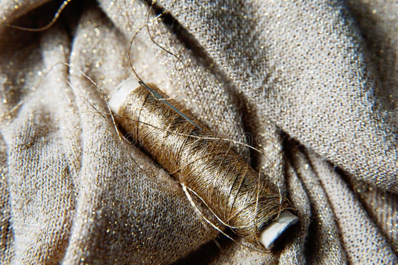 Sewing Textile or Cloth. Scissors Reel of Thread, and Golden Fabric ...
