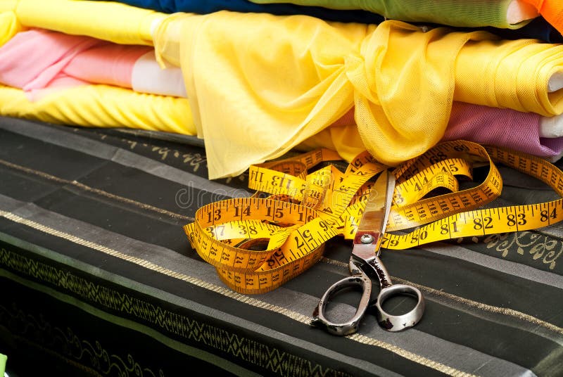 Sewing Textile or Cloth. Work Table of a Tailor. Scissors, Measuring ...