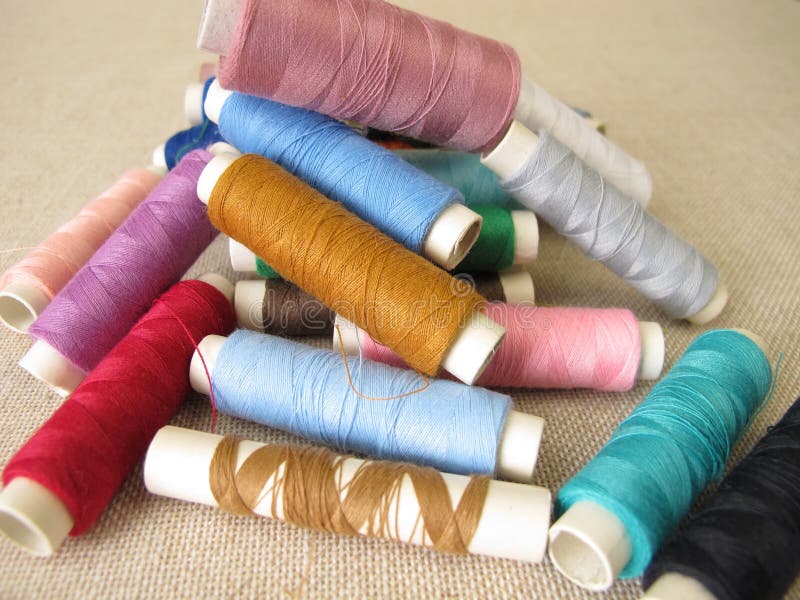 Sewing Thread in Different Colors on Farbric Stock Image - Image of ...