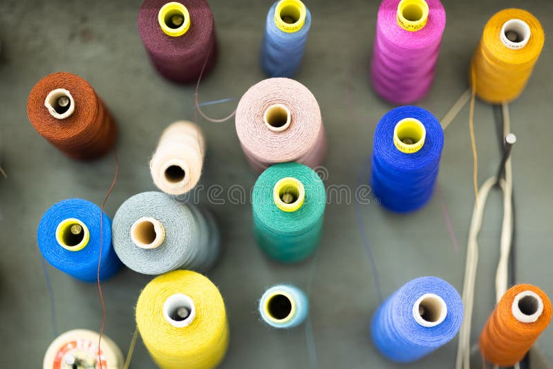 Different Colored Rolls of Sewing Thread Hung on a Wall Stock Image ...
