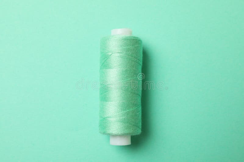 Sewing Thread on Mint Background, Space for Text Stock Photo - Image of ...