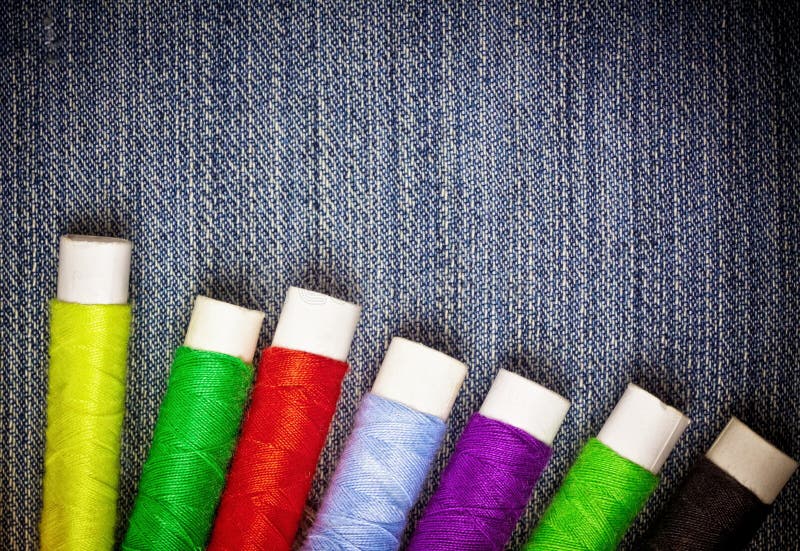 Sewing Thread Reels on Blue Denim Stock Photo - Image of homework ...