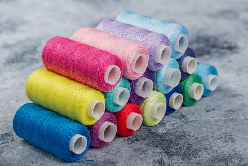 Sewing Threads on Drums. a Lot of Colored Threads for Designers Stock ...
