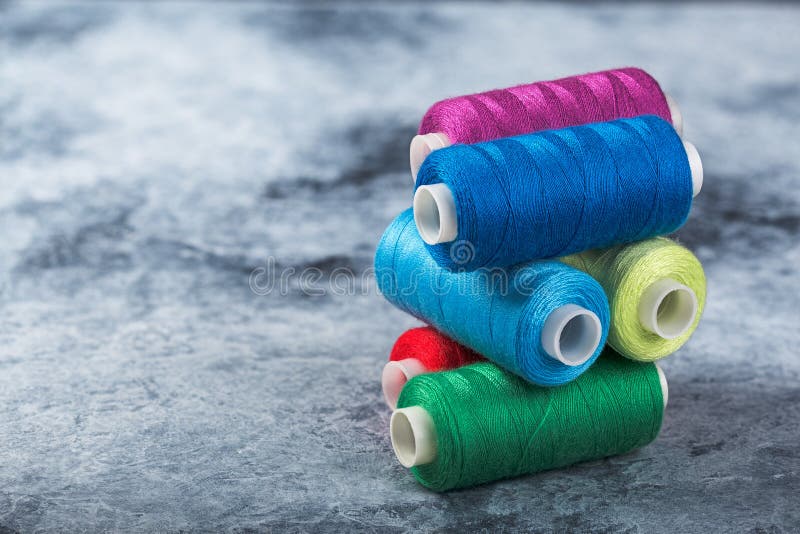 Sewing Threads on Drums. a Lot of Colored Threads for Designers Stock ...