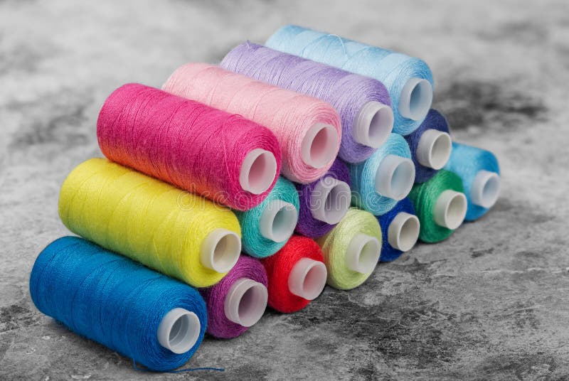 Sewing Threads on Drums. a Lot of Colored Threads for Designers Stock ...