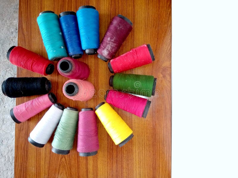 Round Multi Colored Sewing Nylon Thread on Table Stock Photo - Image of ...