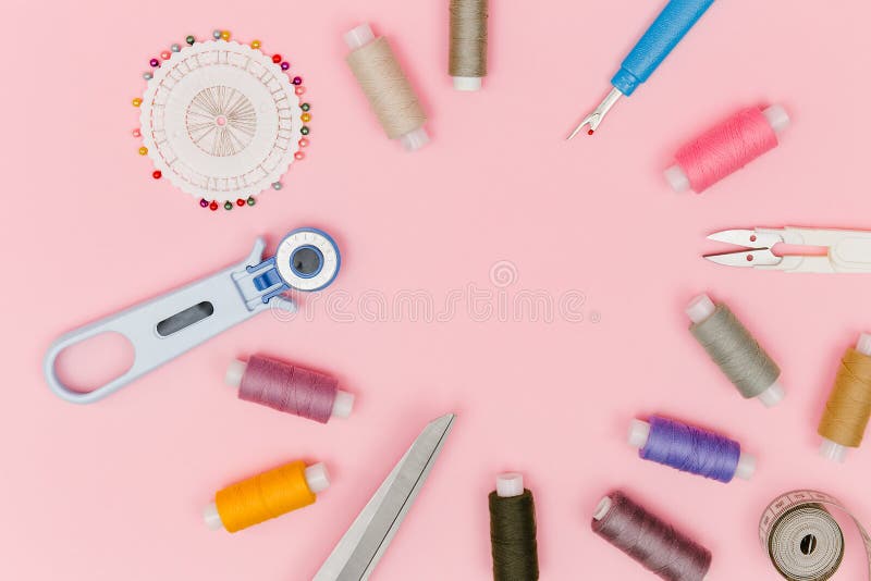 Pink Background with Sewing Accessories and Fabric. Sewing Threads ...