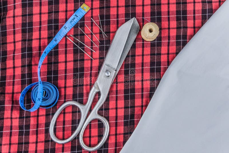Sewing Tools: Large Scissors and Thread with Needles Lying on a ...