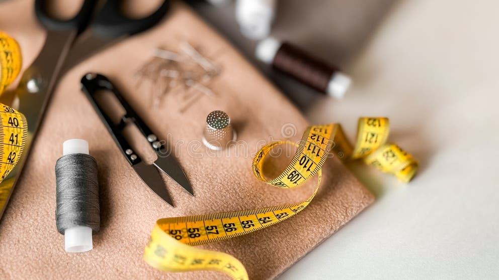 Sewing Tools and Materials on Fabric with Tape Measure and Scissors ...