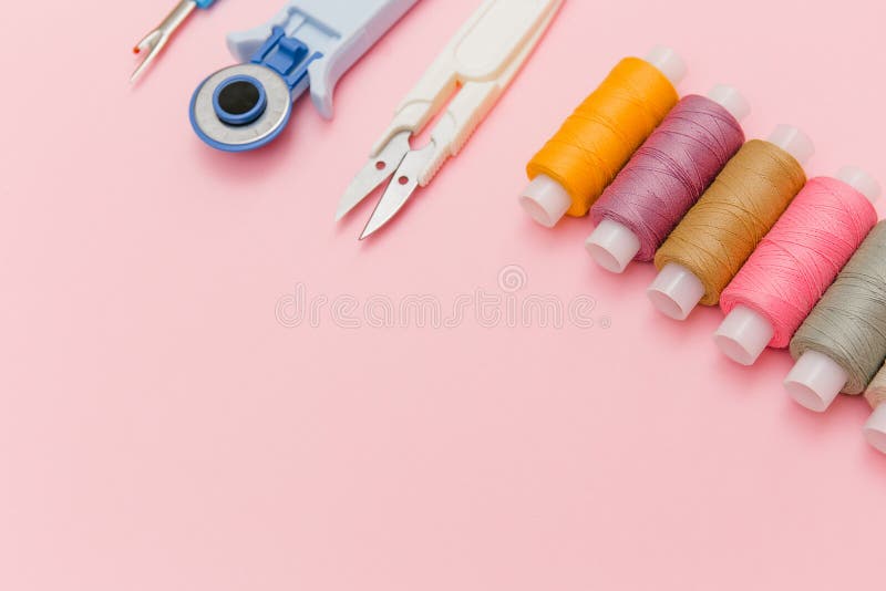 Pink Background with Sewing Accessories and Fabric. Sewing Threads ...
