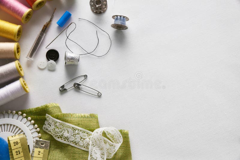 Sewing Tools with Lace on White Fabric Background Top View Stock Photo ...