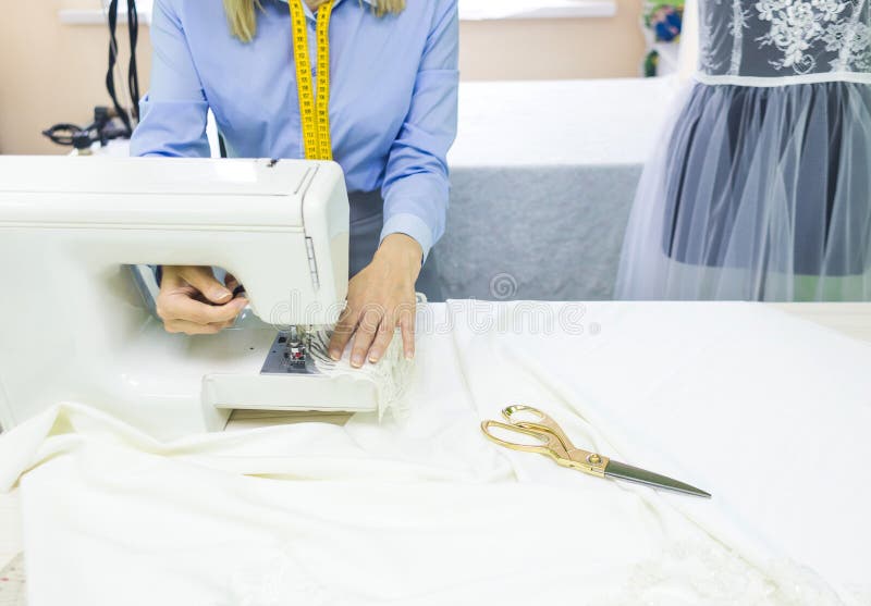 Sewing Workshop. Seamstress at Work. Young Woman Working with Sewing ...