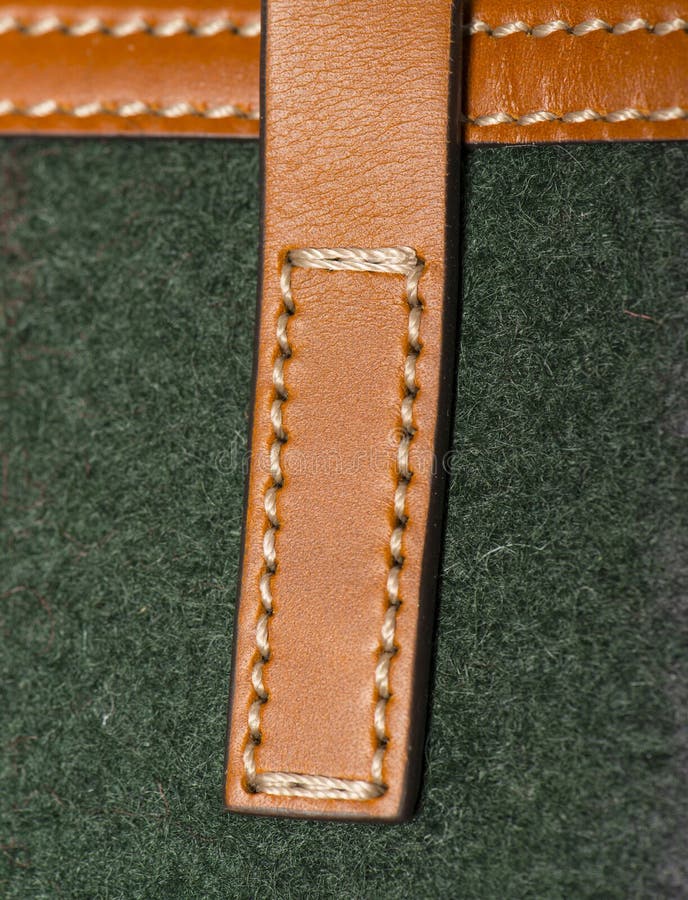 Sewn Leather Fastener on Green Fabric Stock Photo - Image of secure ...