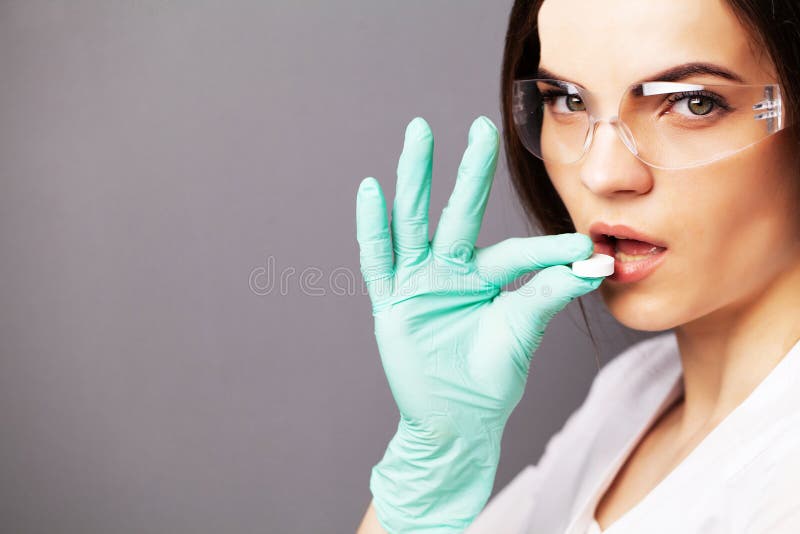 Sexual Health A Doctor In A White Coat Holding A Pill For A Healthy