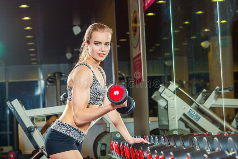 Athlete with a in the Gym Lean on Dumbbell Stock Image - Image of ...