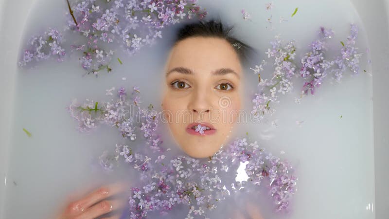 Beautiful Healthy Woman Lies In A Milk Bath Stock Footage Video Of