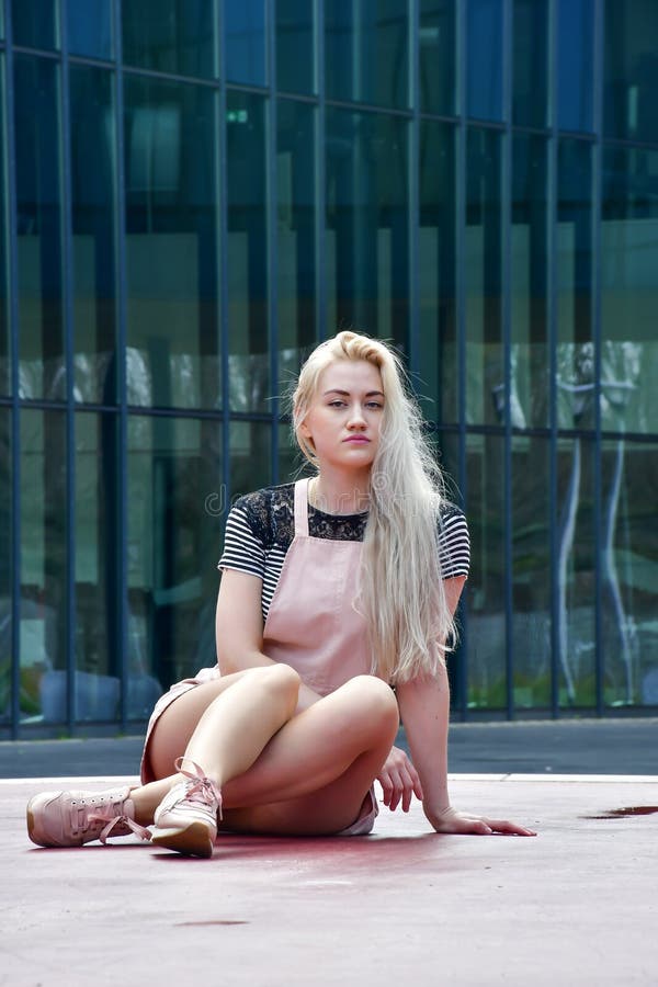 Blonde With Beautiful Legs On The Basketball Court With Mirrored