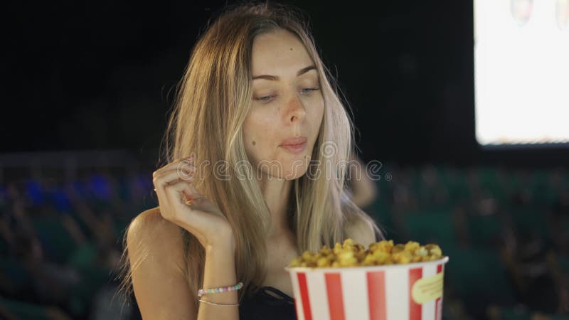 Blonde Eating Popcorn at the Cinema Stock Video - Video of lifestyle ...