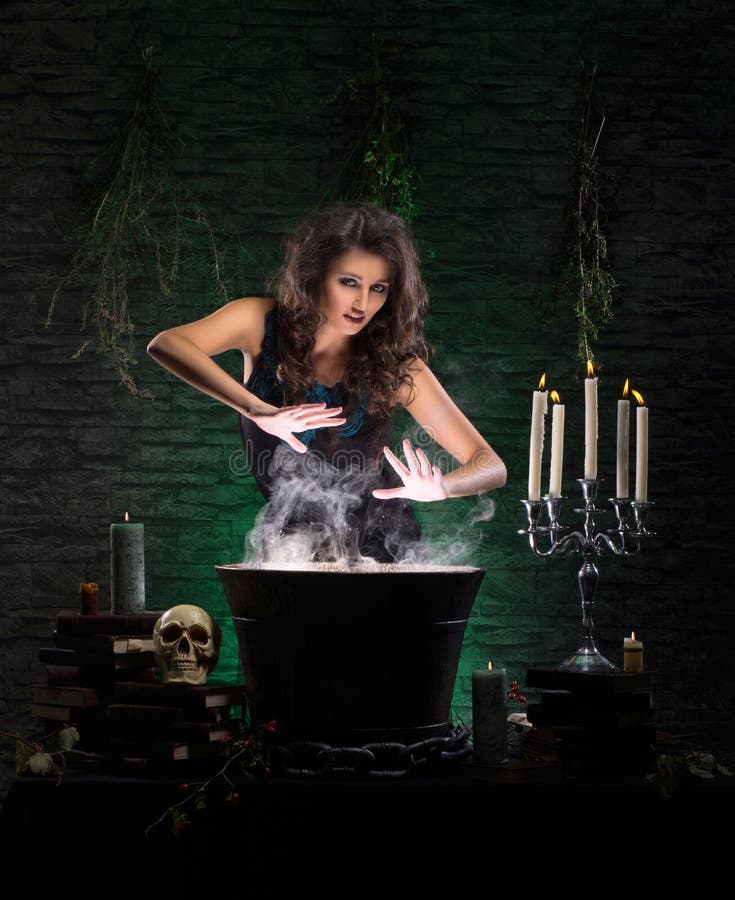 A Brunette Witch Making Poison Stock Photo - Image of evil, beauty ...