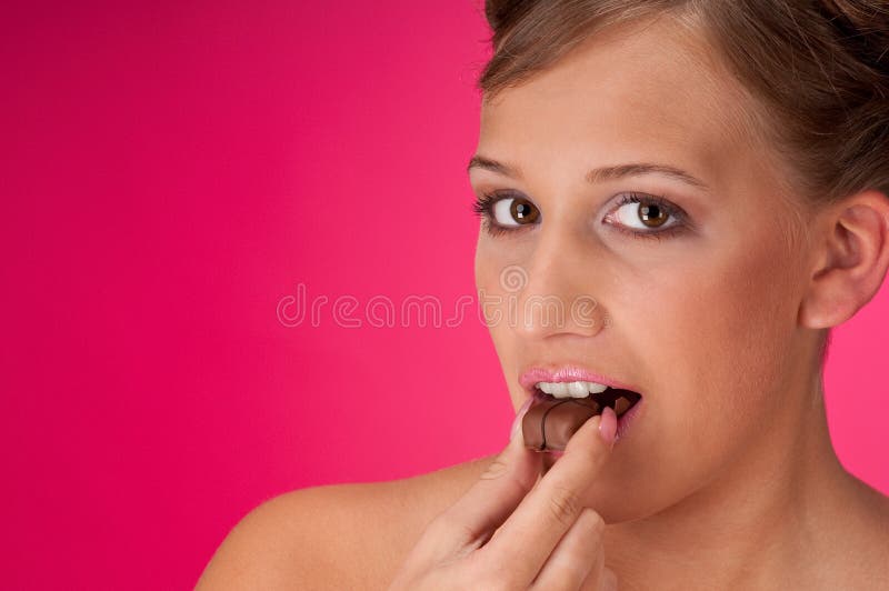 Brunette Woman Eating Chocolate Stock Image - Image of candy, face: 7953409