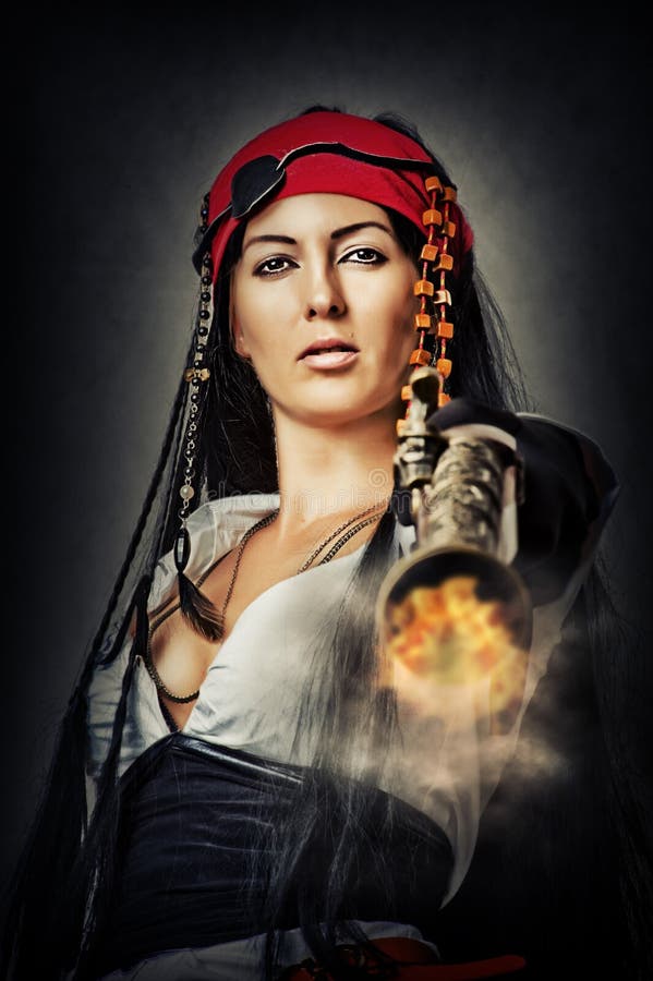 Female Pirate Shooting from Gun Stock Photo - Image of brunette, mist ...