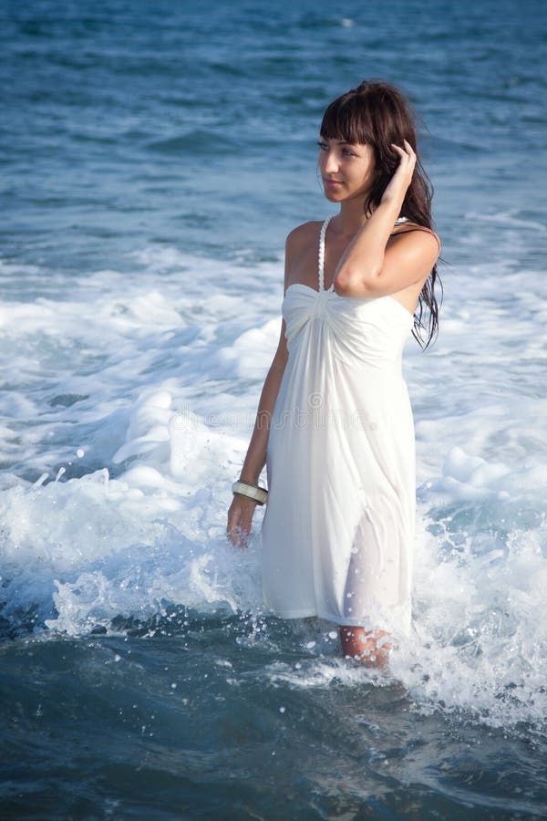 Girl Standing in the Ocean Waves Stock Image - Image of resort, body ...