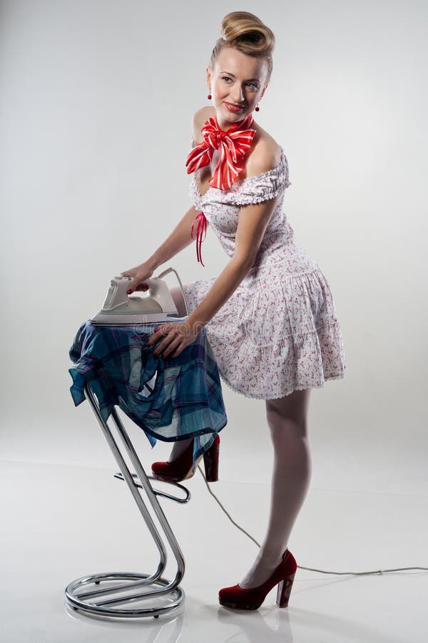 Girl In The Style Of Pin-up Posing With Iron Royalty Free Stock Photos ...