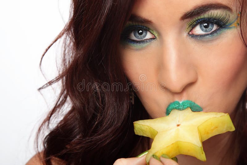 Woman Eating Star Fruit stock image. Image of attractive - 28965159
