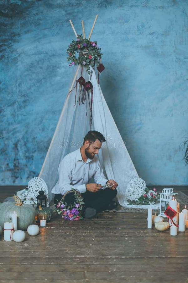Man in a teepee stock photo. Image of shirt, classic - 133986942