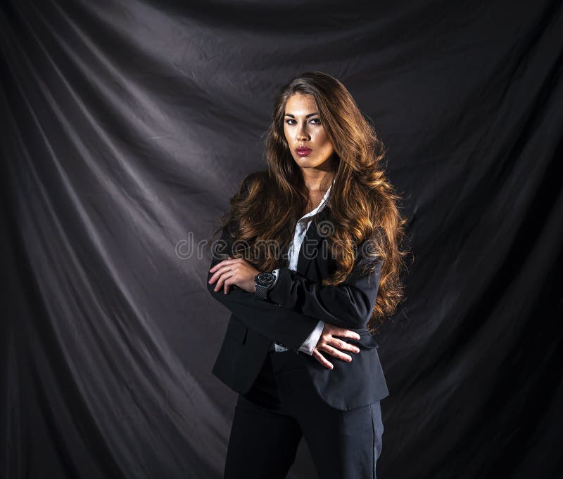 Mixed Race Model Poses in a Business Suit in a Studio Environment Stock ...
