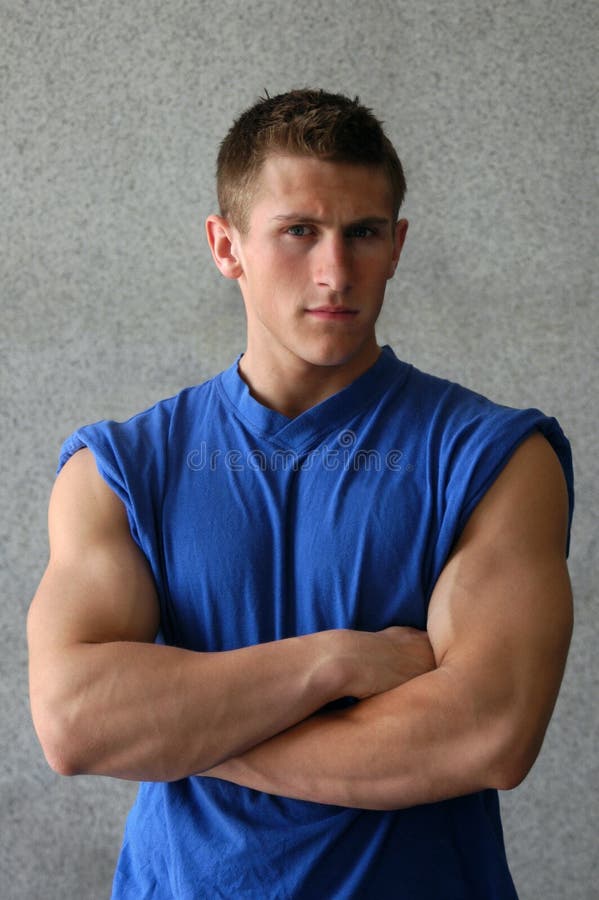Muscular Man in a Blue T-shirt Stock Photo - Image of fitness, male ...