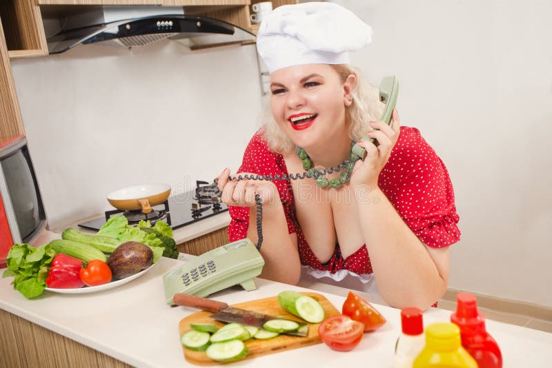 Pinup Plus Size Caucasian Woman In Cook`s Hat Talking By Phone And