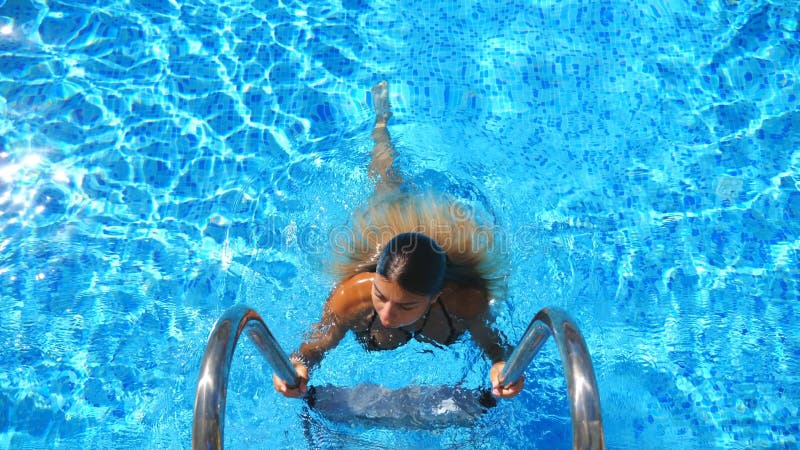 Tanned Woman Swimming Underwater And Getting Out Of Pool Attractive