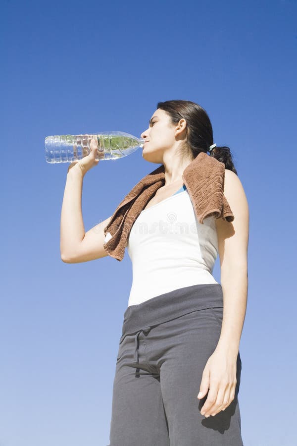 Woman Drinking Water after Exercise Stock Photo - Image of beautiful ...