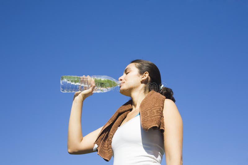 Woman Drinking Water after Exercise Stock Photo - Image of holding ...