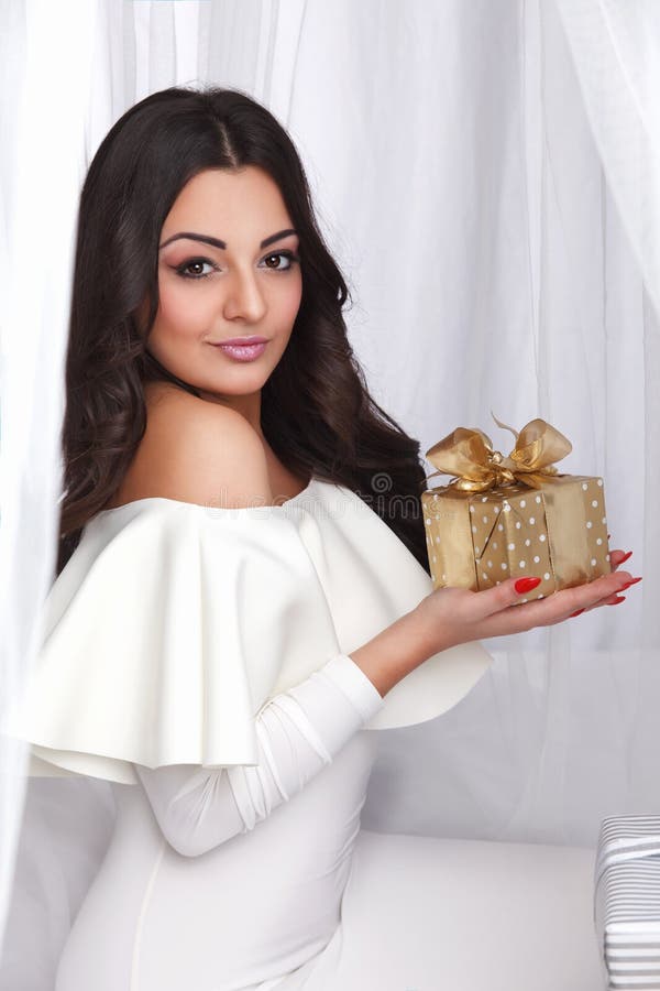 Woman holding a present stock photo. Image of girl, hold - 62041804