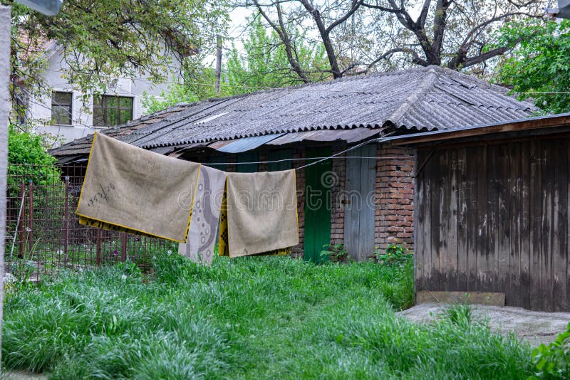 Shabby Hut Surrounded by Grass and Trees Stock Photo - Image of tiles ...